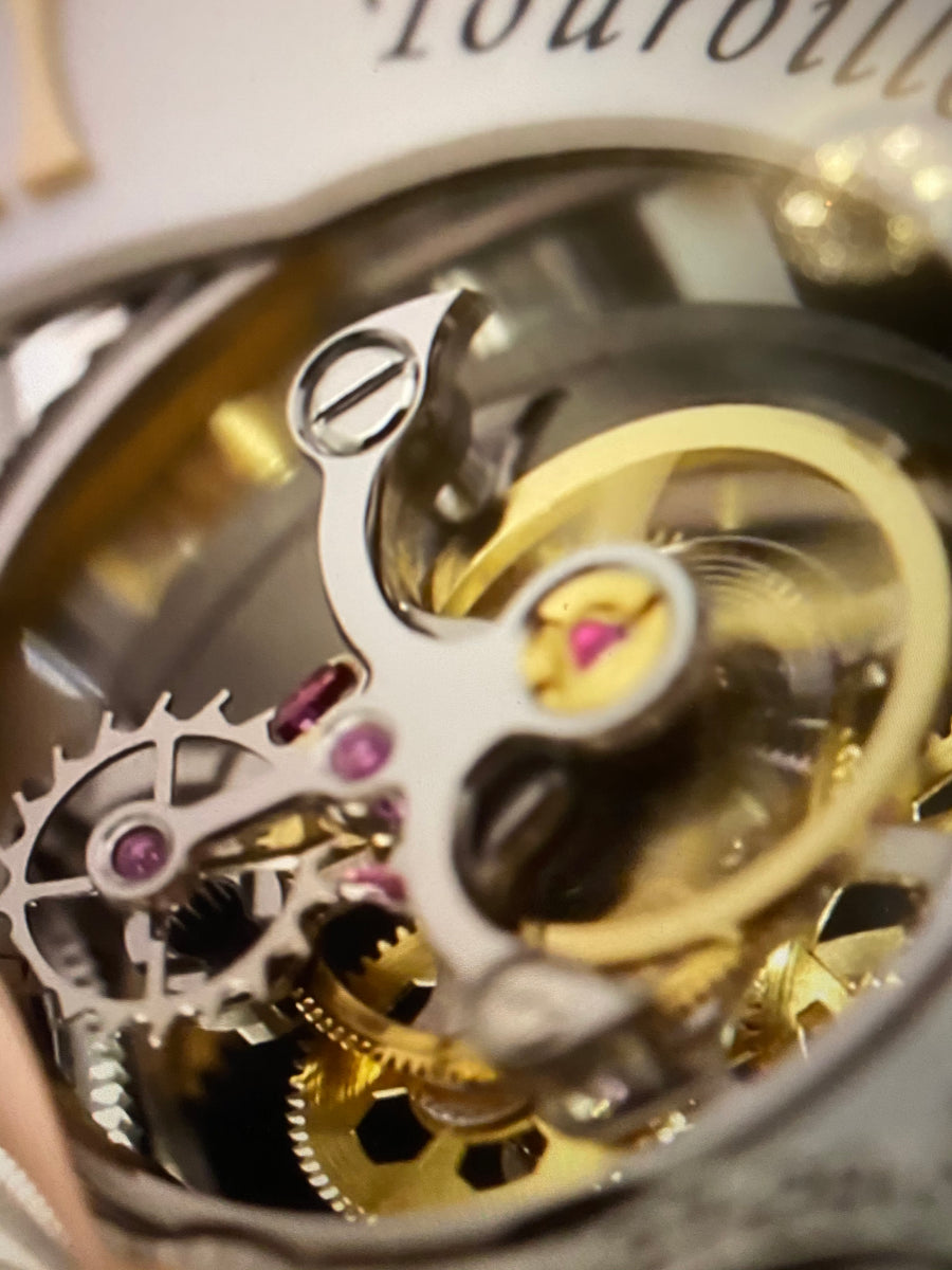 Difference between Tourbillon style watch or ( Open heart ) vs Genuine ...